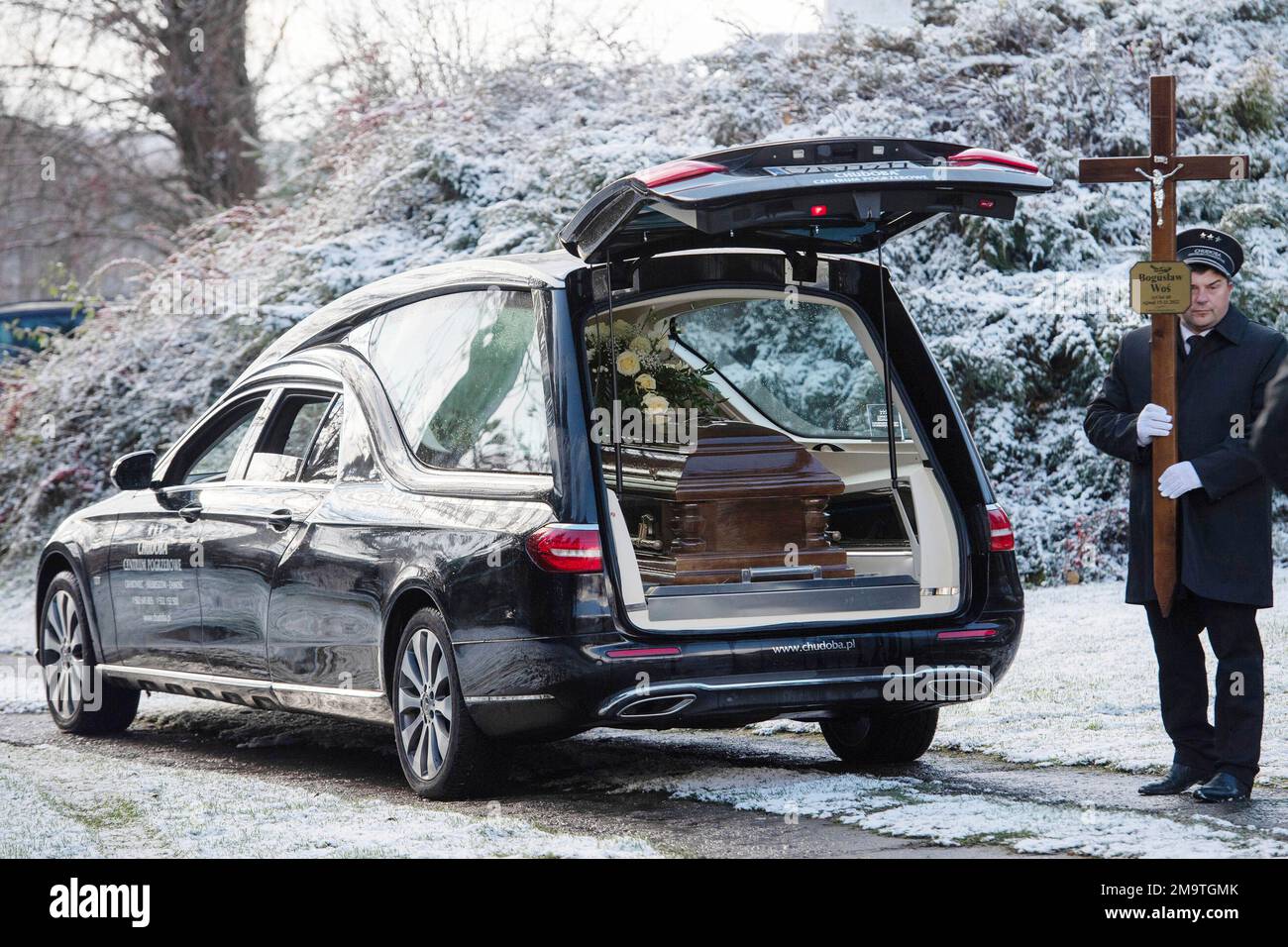 A view of a vehicle carrying the coffin of Boguslaw Wos, one of two ...