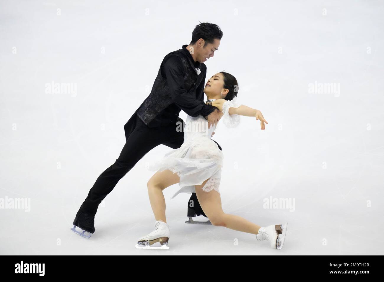 Kana Muramoto, right, and Daisuke Takahashi of Japan perform in the ice ...