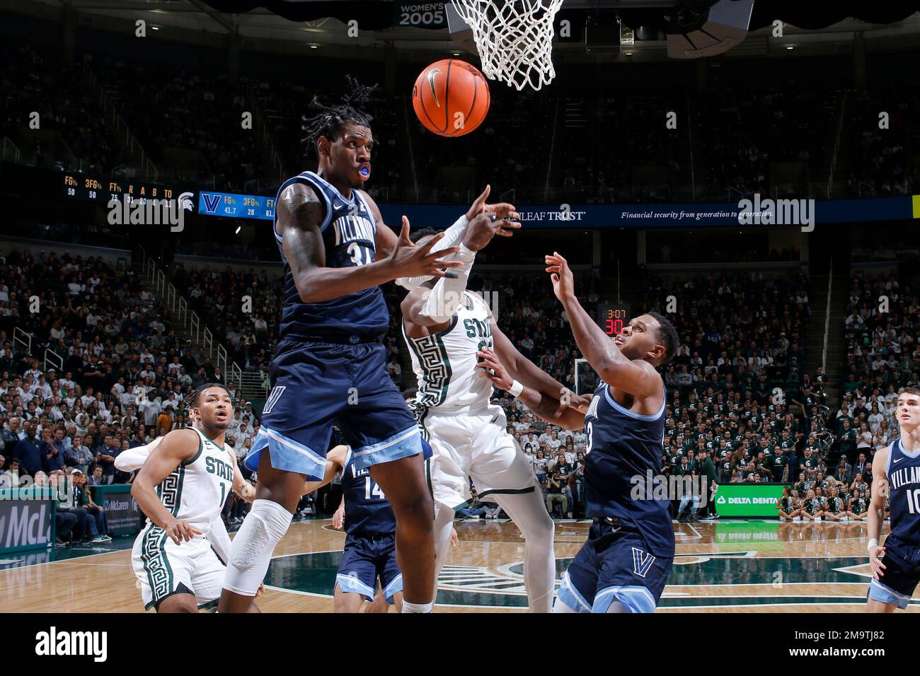 Villanova's Brandon Slater, left, Michigan State's Malik Hall, center ...
