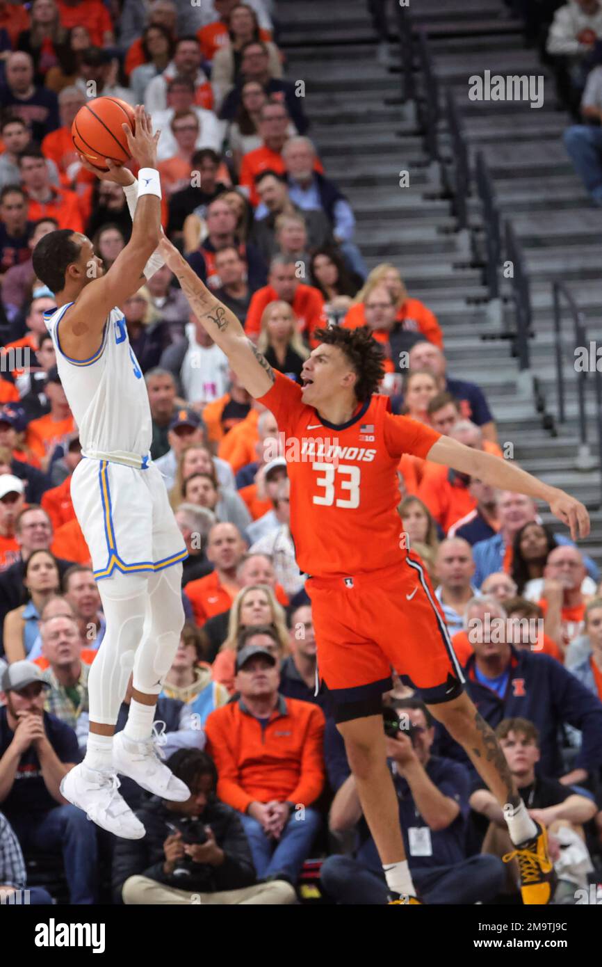 UCLA guard Amari Bailey shoots over Illinois forward Coleman Hawkins (33) during the first half ...