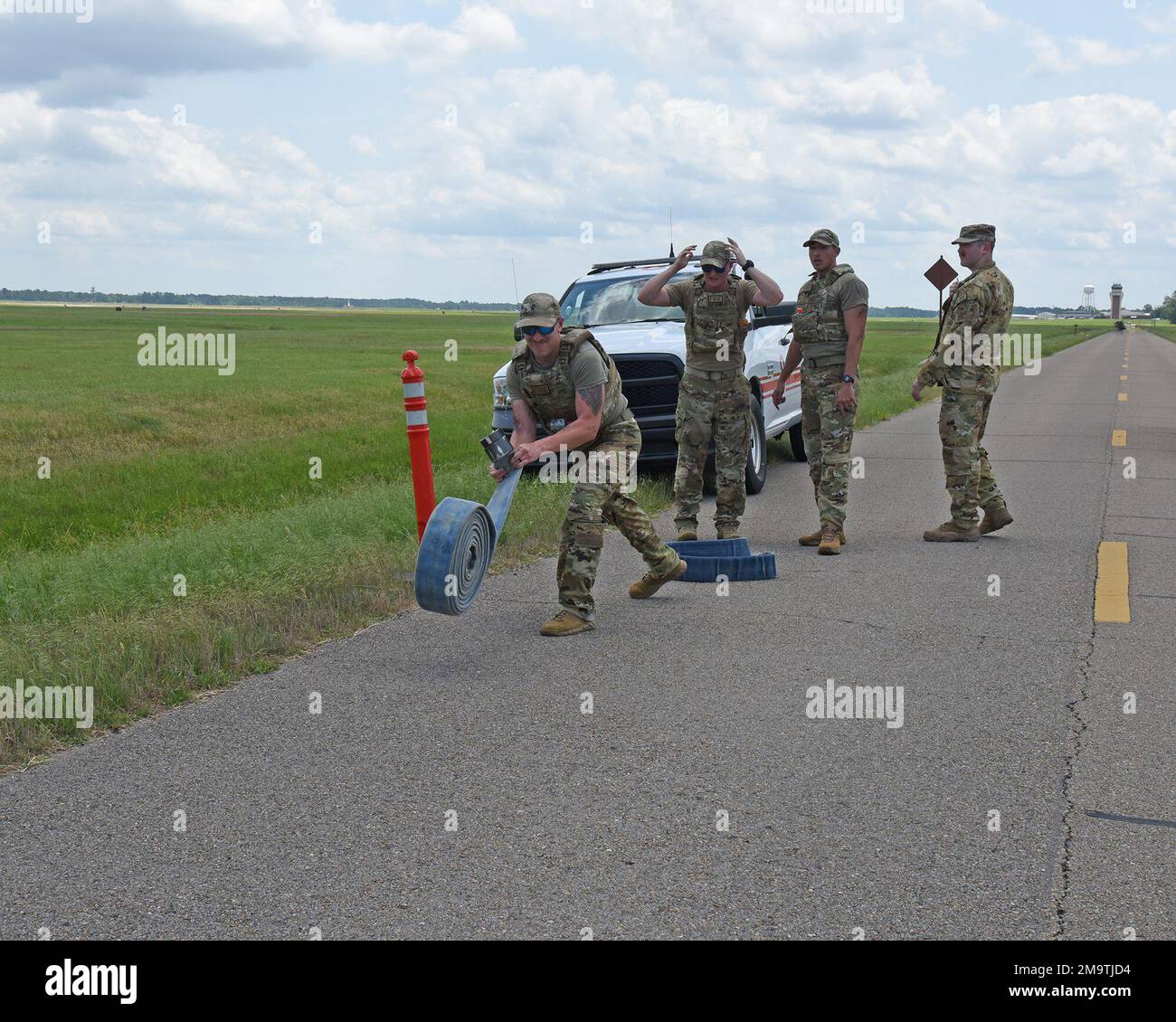 A1C Trout, 14th Civil Engineering firefighter, throws out a fire hose ...