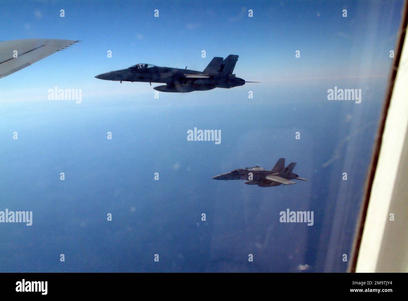 Two US Navy (USN) F/A-18C Hornet aircraft assigned to Strike Fighter ...