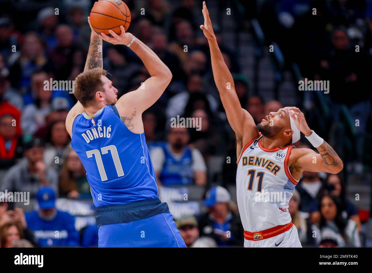 Dallas Mavericks point guard Luka Doncic (77) looks to shoot over ...