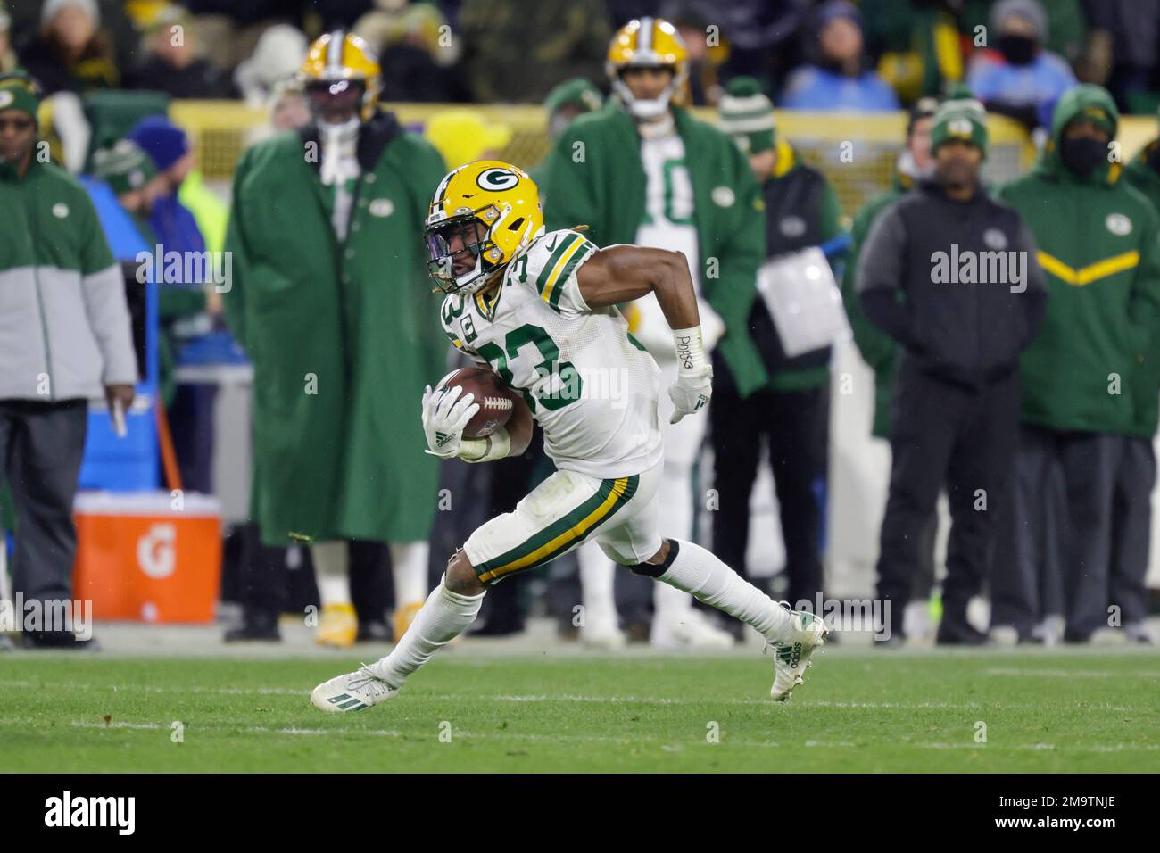 Green Bay Packers running back Aaron Jones (33) rushes against the Tennessee Titans during an ...