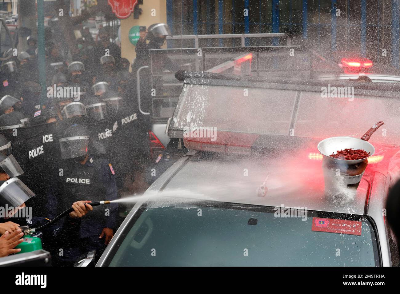 Police extinguish burning chili peppers and salt set aflame by ...