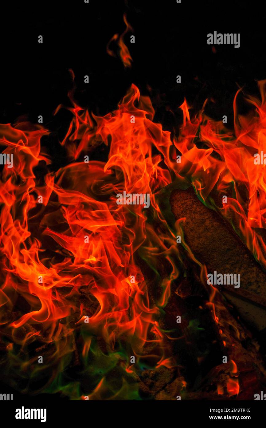 Multicolored flame.Firewood burning in bonfire.Burning bonfire.magical ...