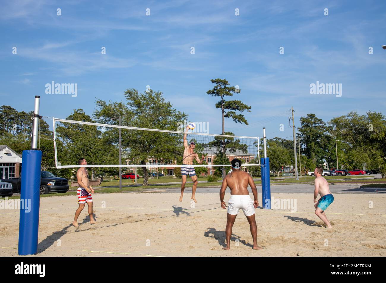 A Red Bulls team member spikes the volleyball over the net during the ...