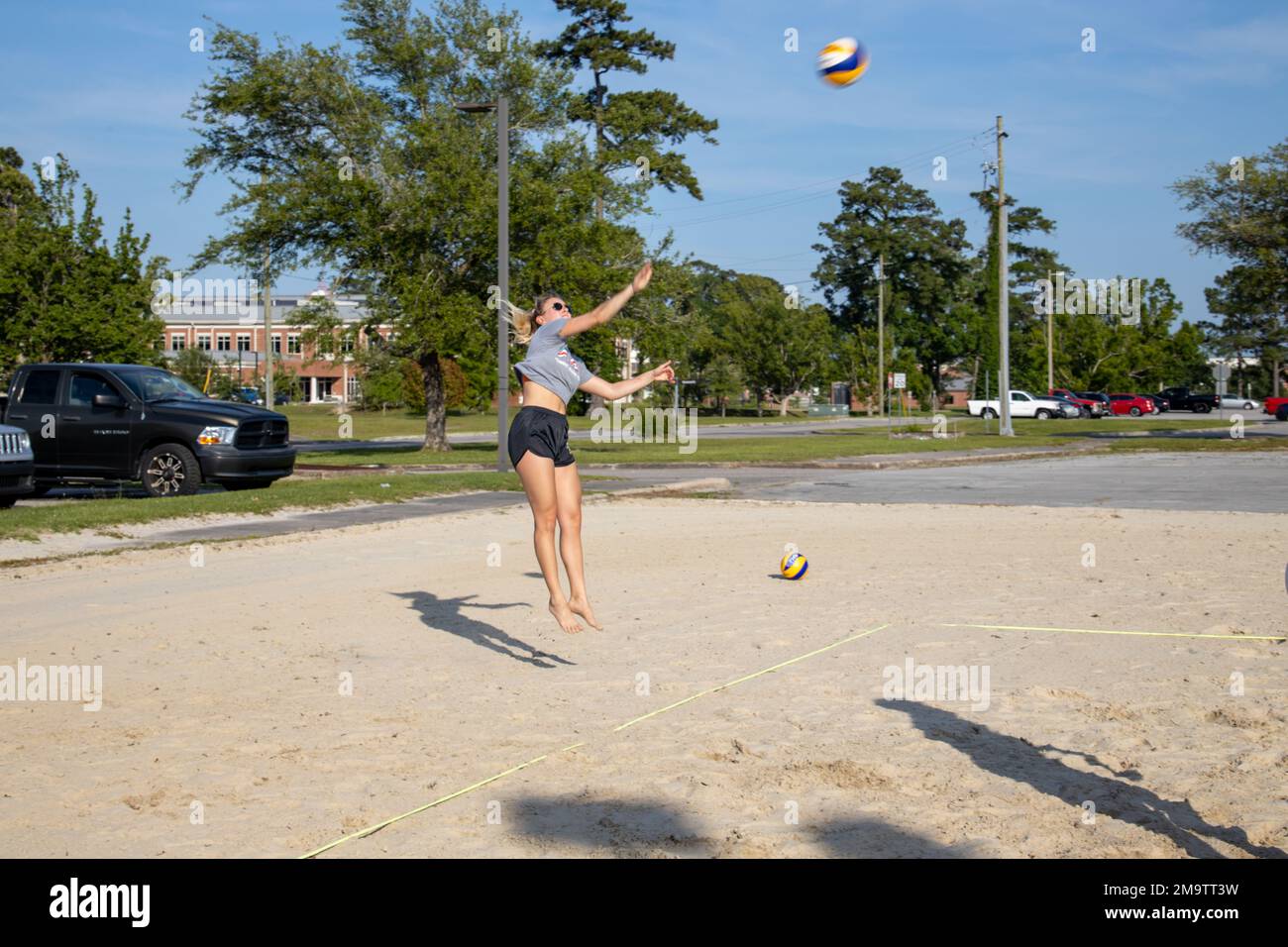 Ashlyn Robbins, of team Vertical Vibes, spikes the volleyball during ...