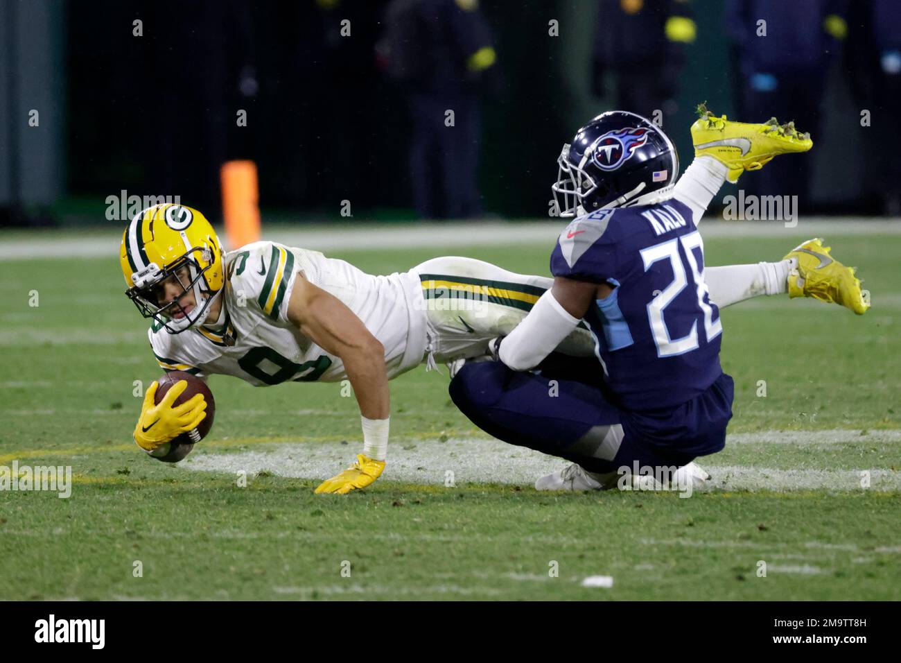 Green Bay Packers wide receiver Christian Watson (9) is stopped after ...