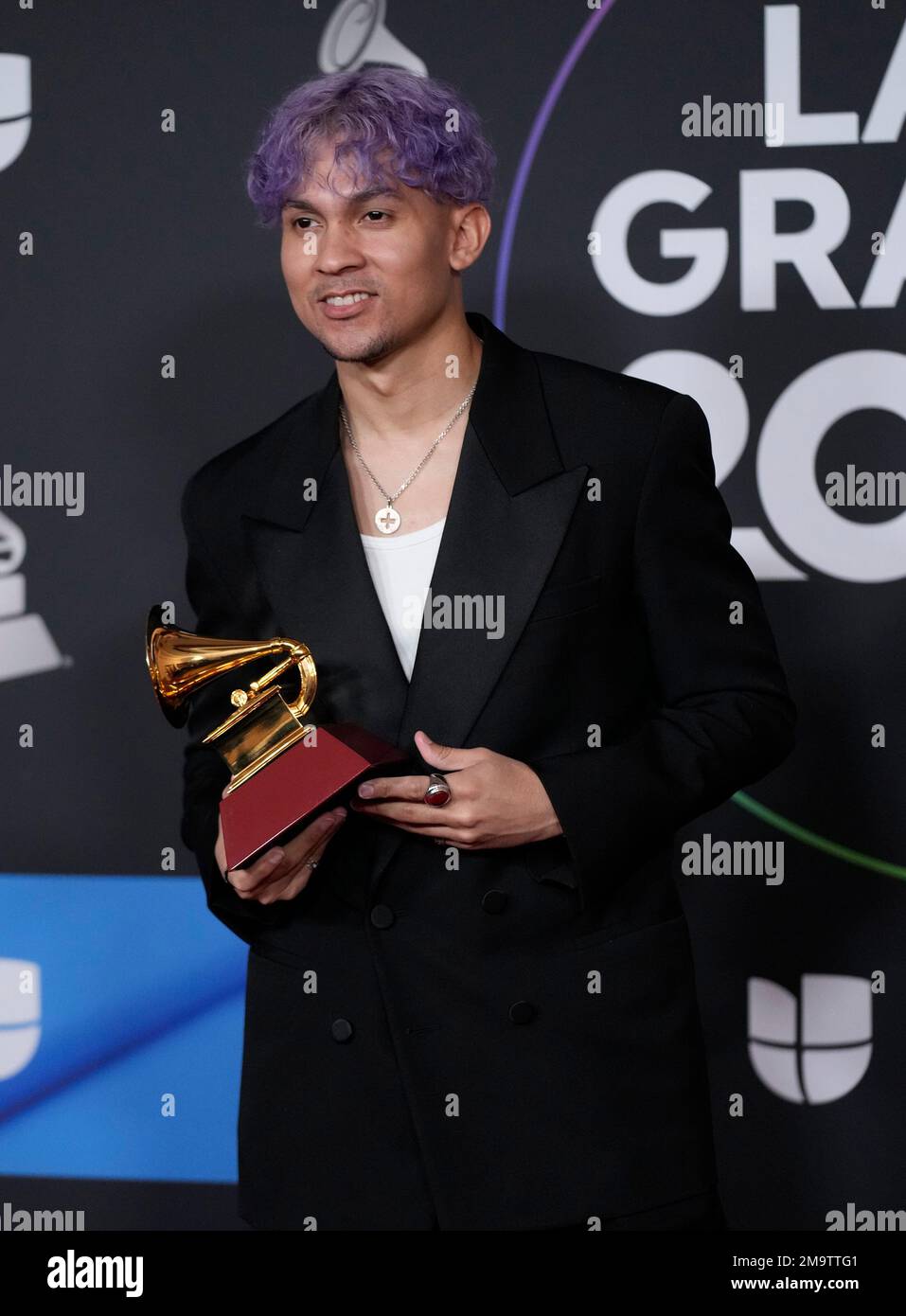 Tainy poses in the press room with the award for best reggaeton ...