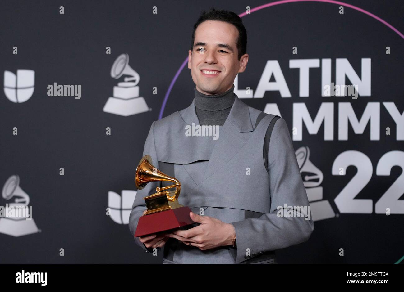 Edgar Barrera poses in the press room with the award for best regional ...