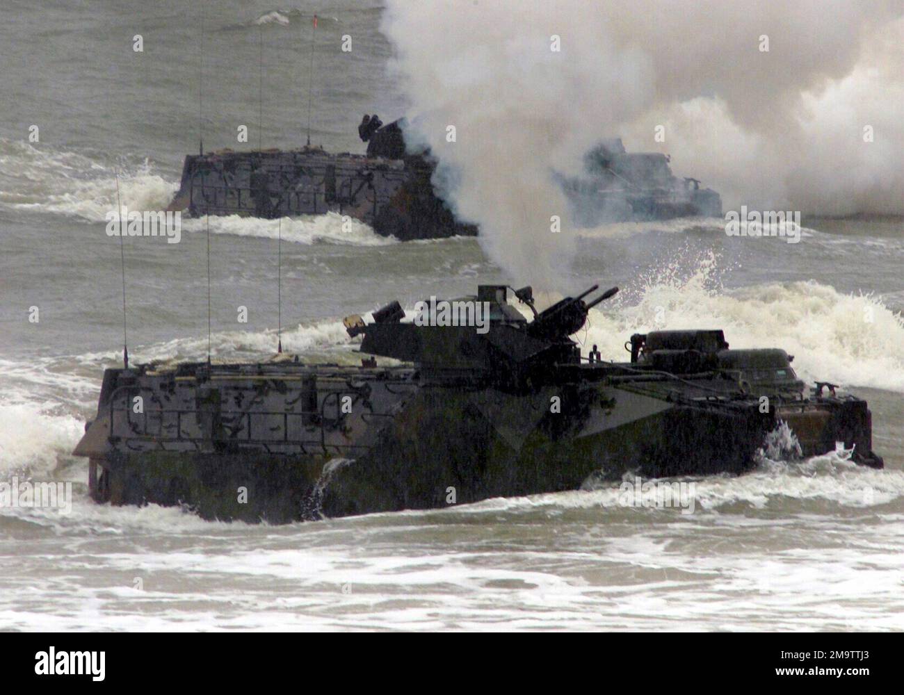 US Marine Corps (USMC) Amphibious Assault Vehicles (AAV7A1), lay smoke ...