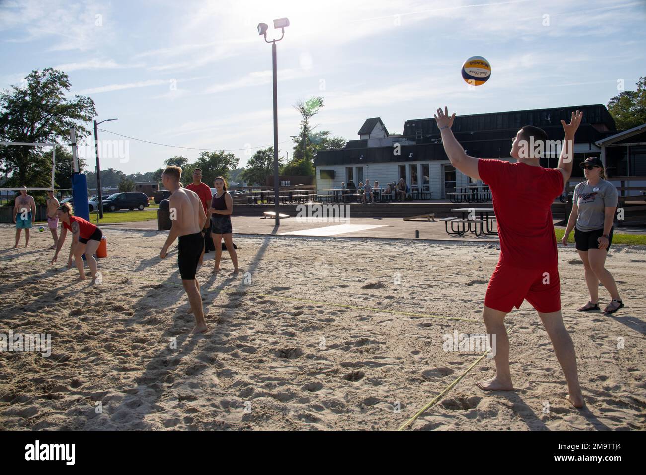 A Red Bulls team member serves the volleyball during the championship ...