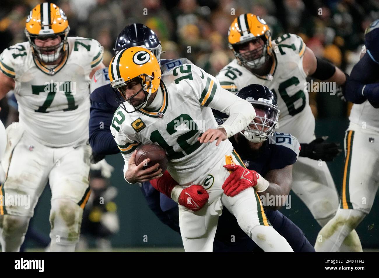 Green Bay Packers quarterback Aaron Rodgers (12) is sacked by Tennessee ...