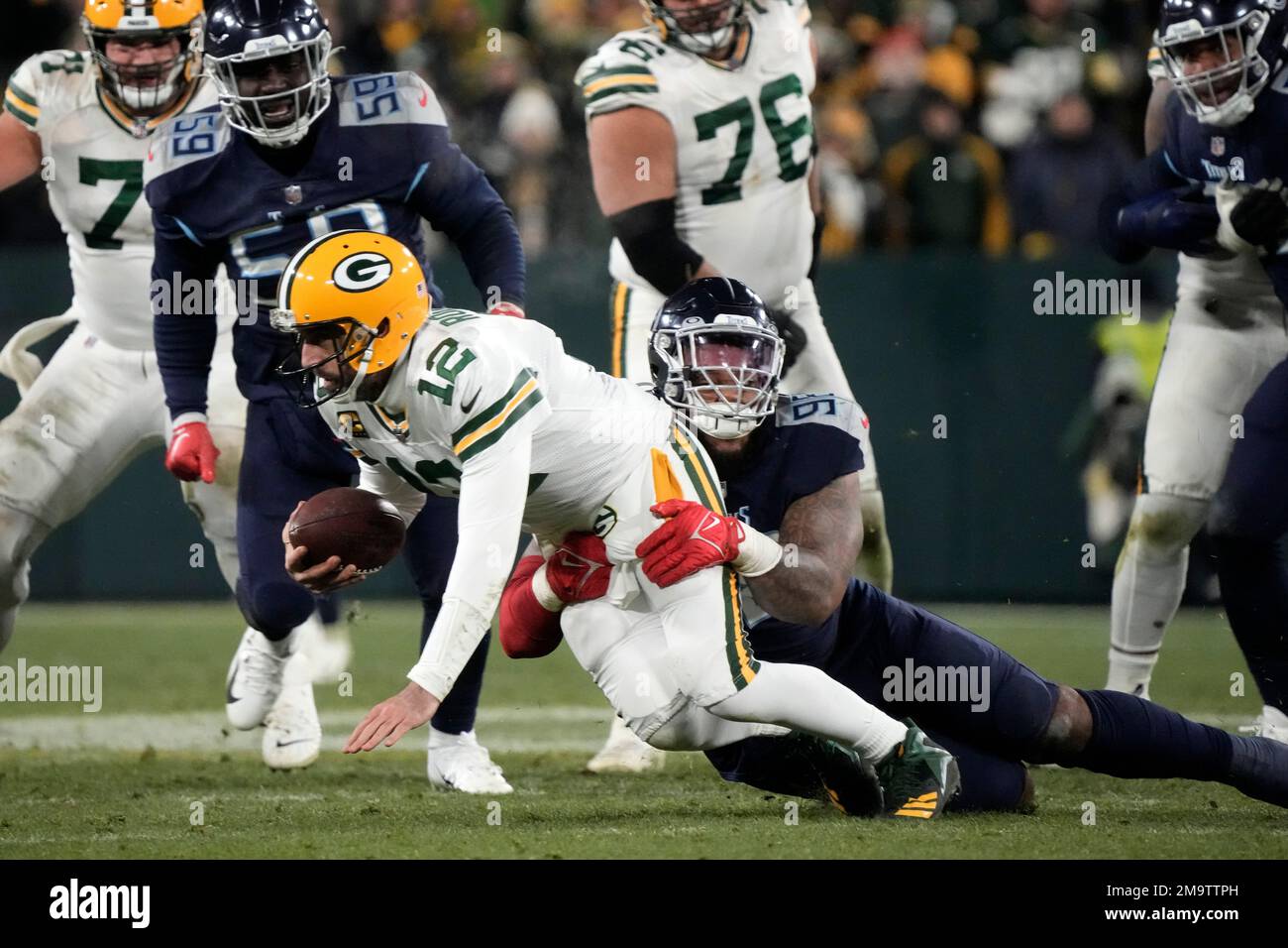 Green Bay Packers quarterback Aaron Rodgers (12) is sacked by Tennessee ...
