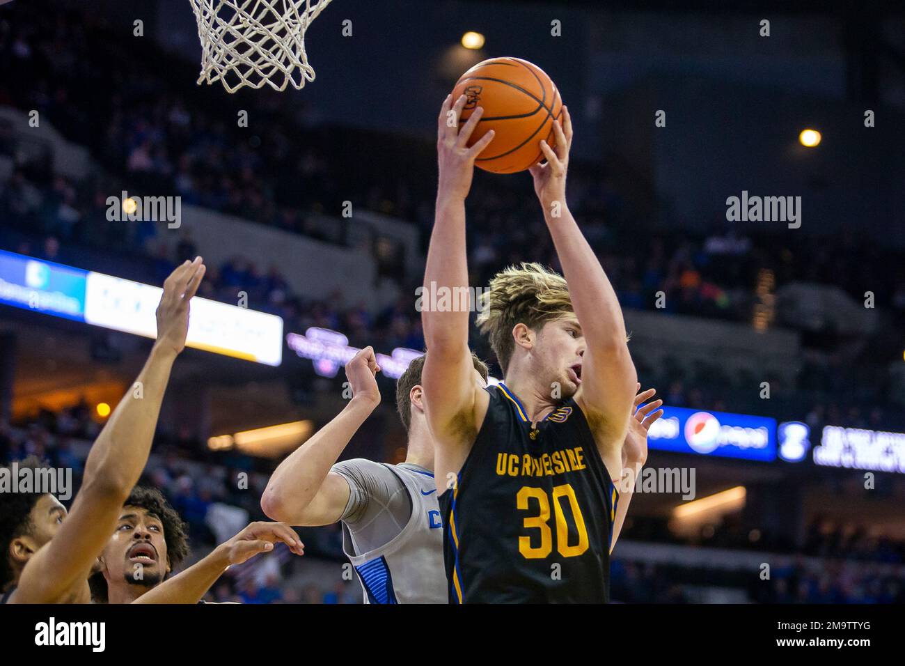 UC Riverside's Lachlan Olbrich (30) grabs the rebound against Creighton ...