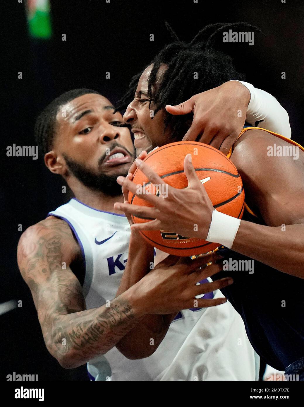 Kansas State guard Desi Sills, left, and Kansas City guard Shemarri ...