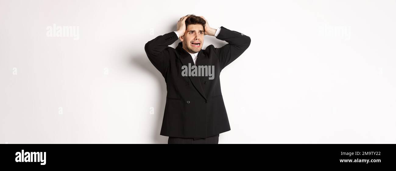 Image of anxious businessman start to panic, looking left with worried ...