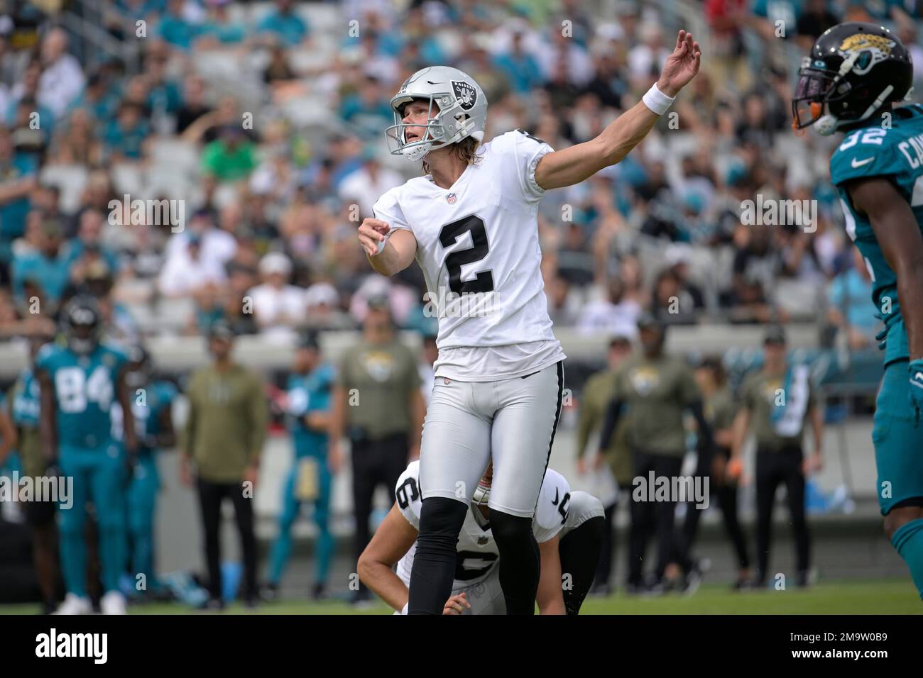 Las Vegas Raiders place kicker Daniel Carlson (2) watches the flight of ...
