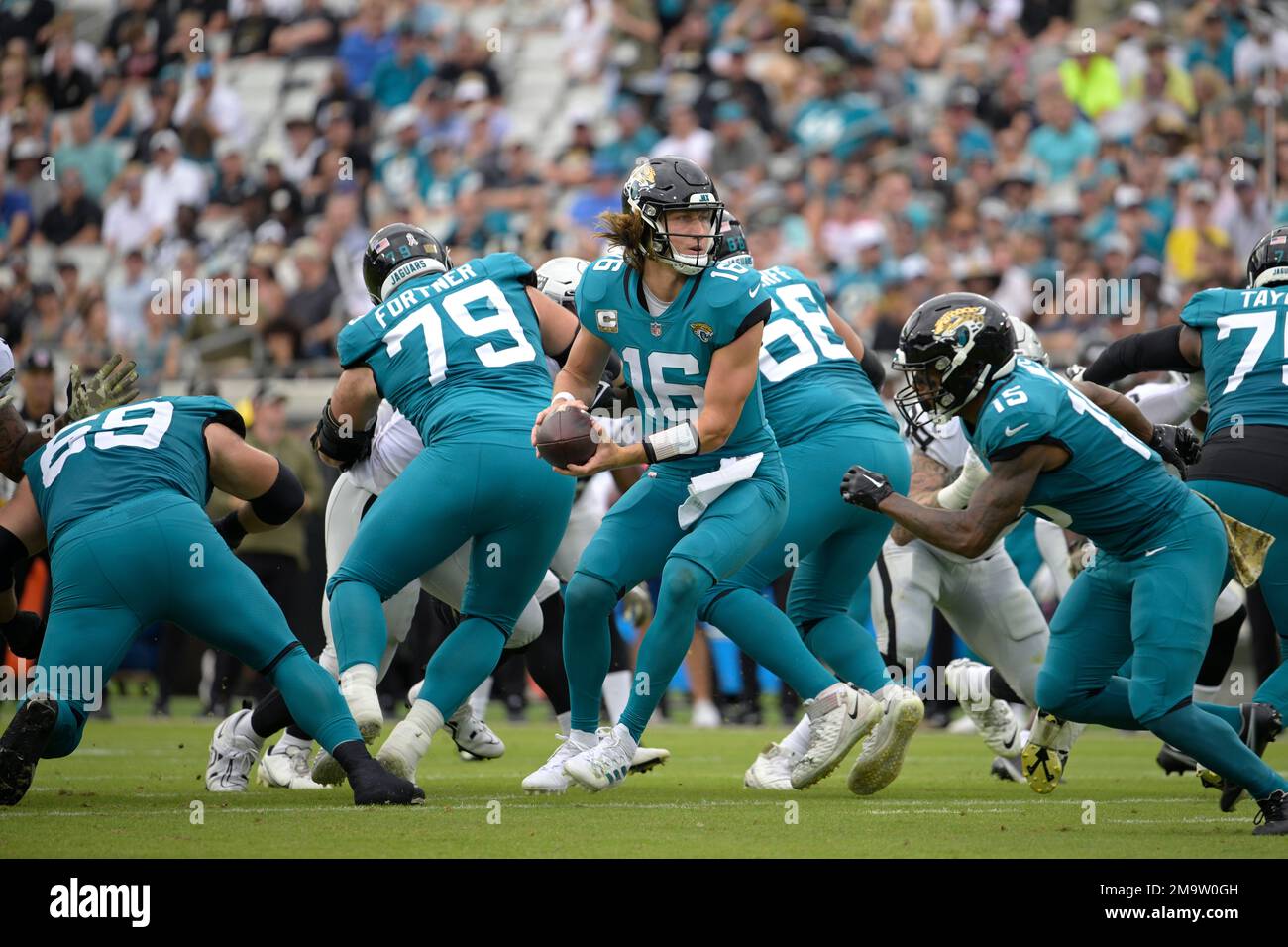 Jacksonville Jaguars quarterback Trevor Lawrence (16) runs a play ...