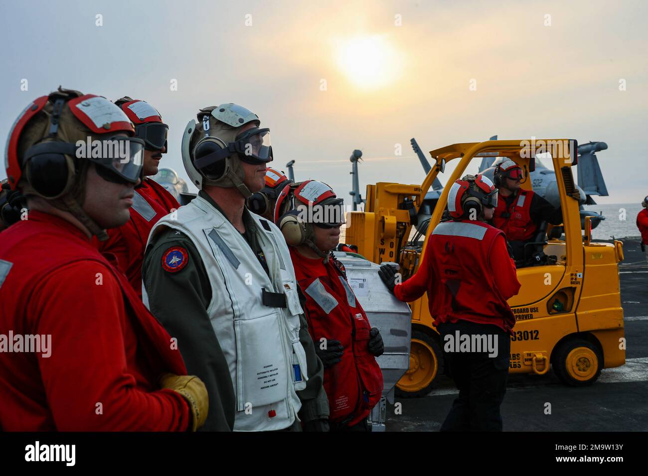 PHILIPPINE SEA (May 20, 2022) Rear Adm. J.T. Anderson, left, commander, Carrier Strike Group ...