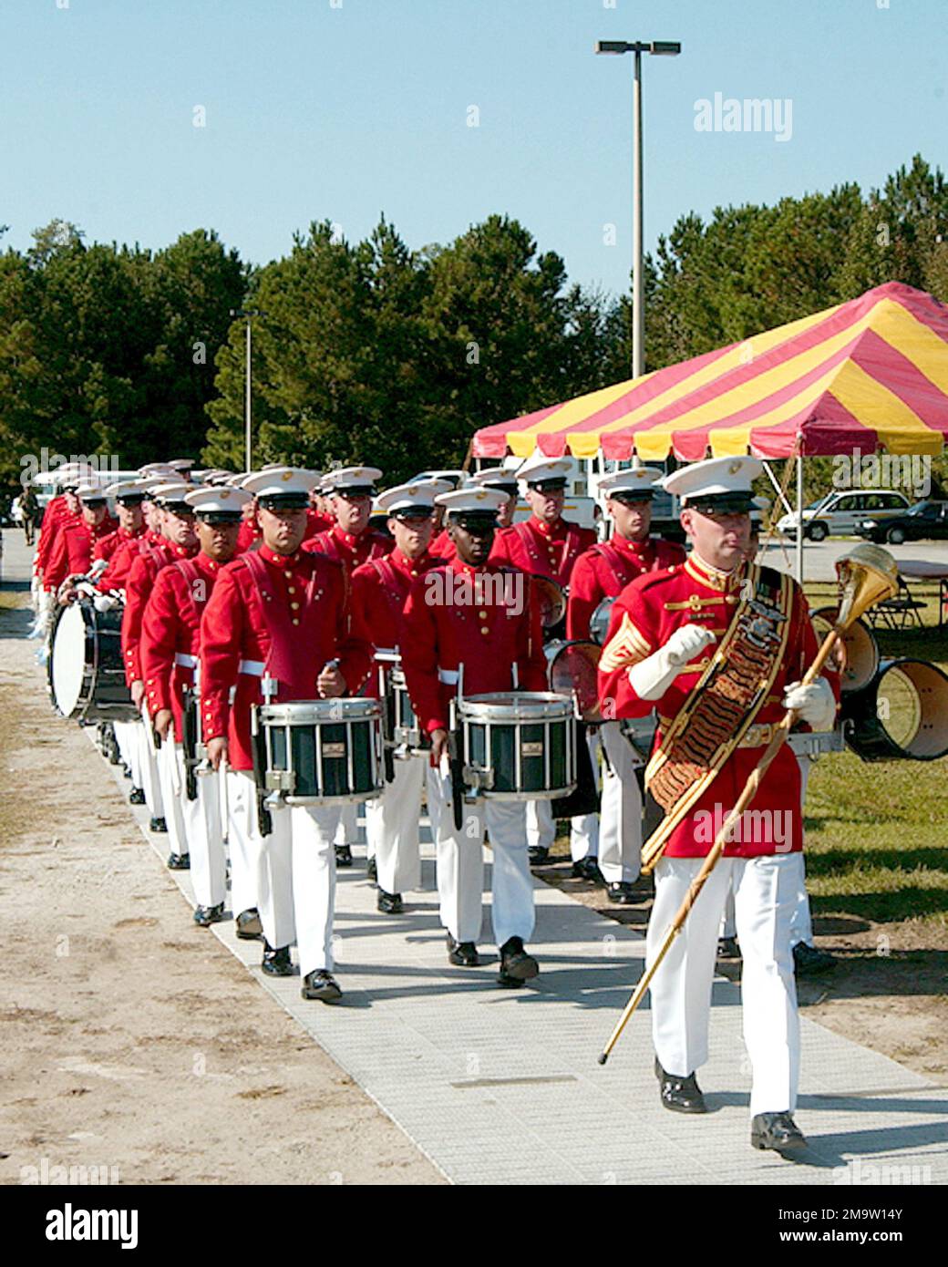 The US Marine Corps (USMC) Band performs and marches at a parade ground ...