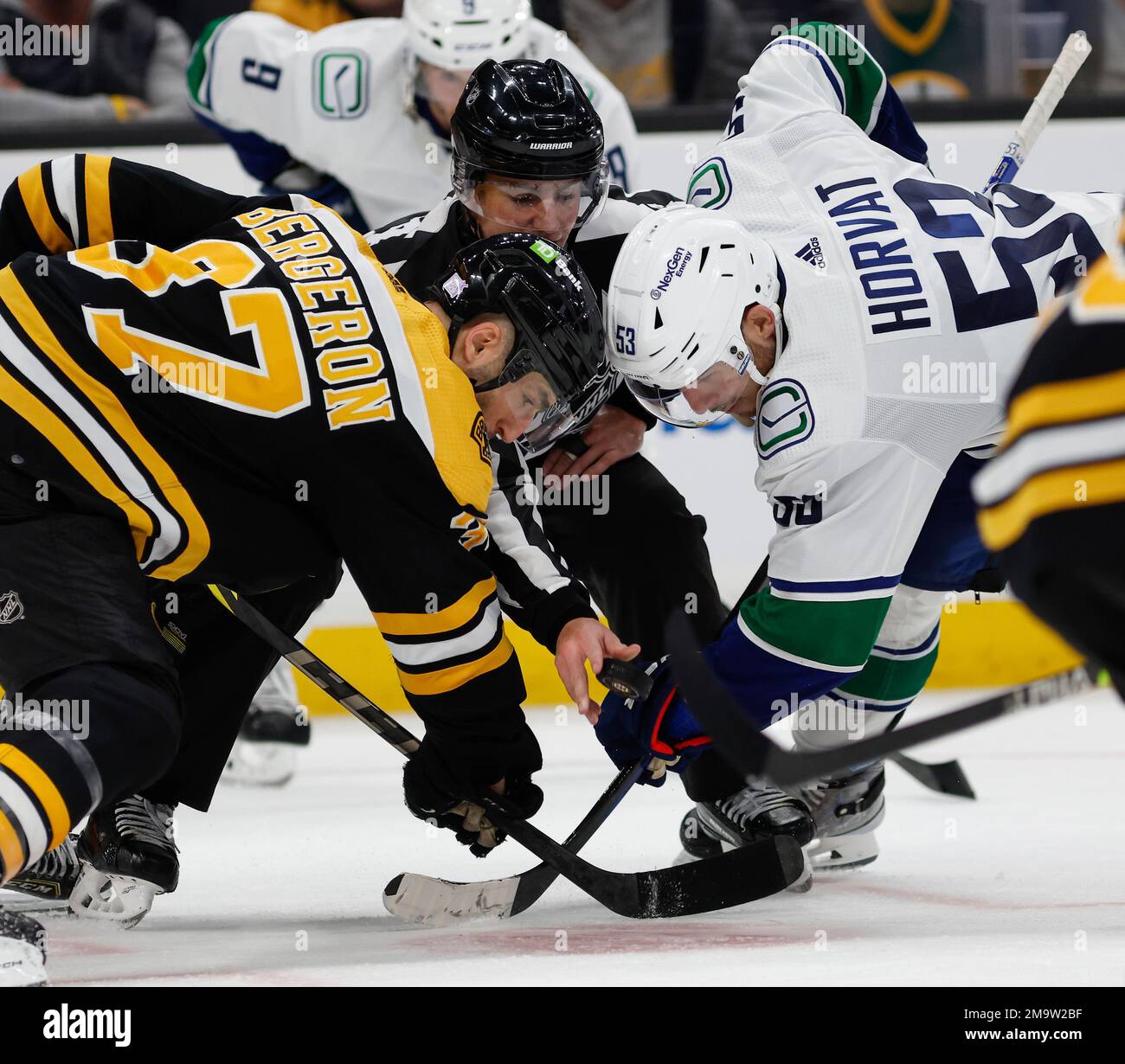 Boston Bruins center Patrice Bergeron takes a face-off against ...