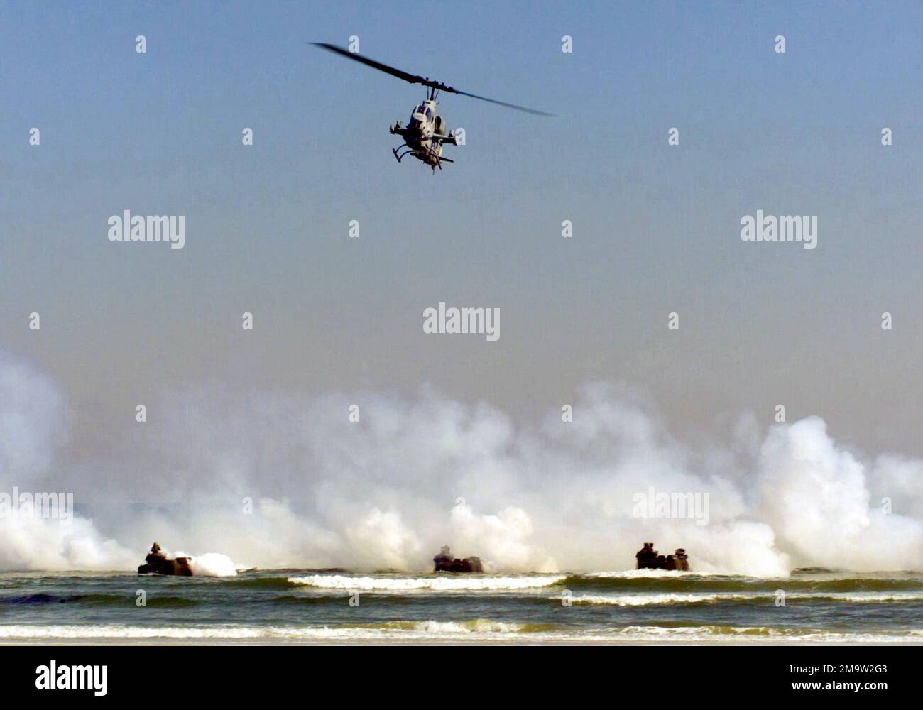 A US Marine Corps (USMC) AH-1W Super Cobra helicopter provides close ...