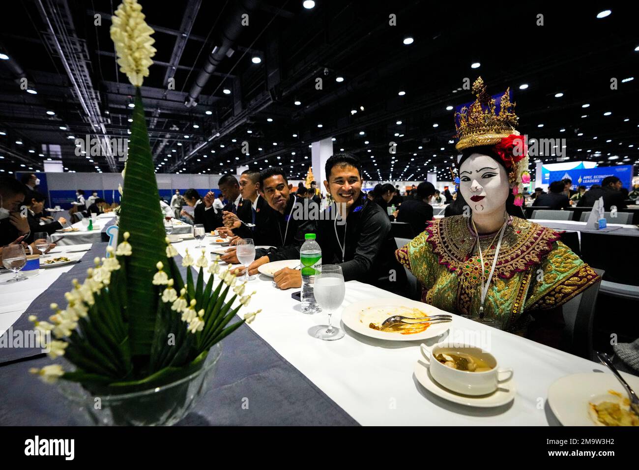 A Thai traditional dancer in costume finishes her lunch during the Asia ...
