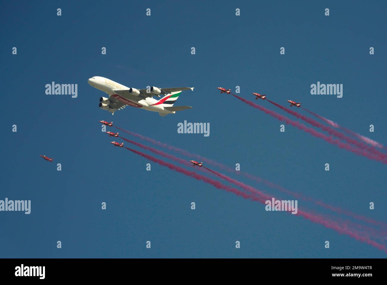 An Emirates Airbus A380 flies over downtown Dubai, United Arab Emirates ...