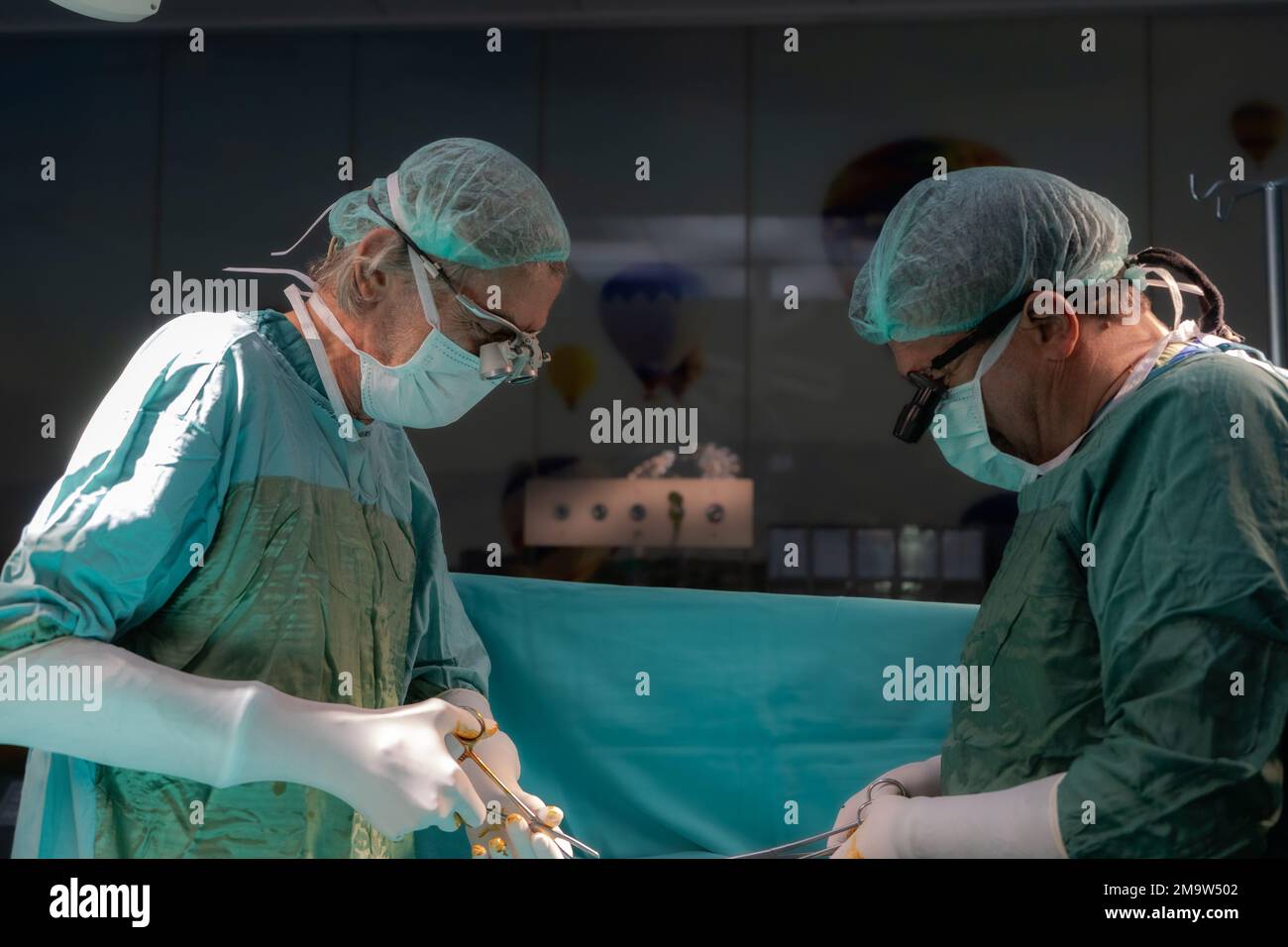 Open heart surgery doctor perform open heart surgery. Doctors in green ...