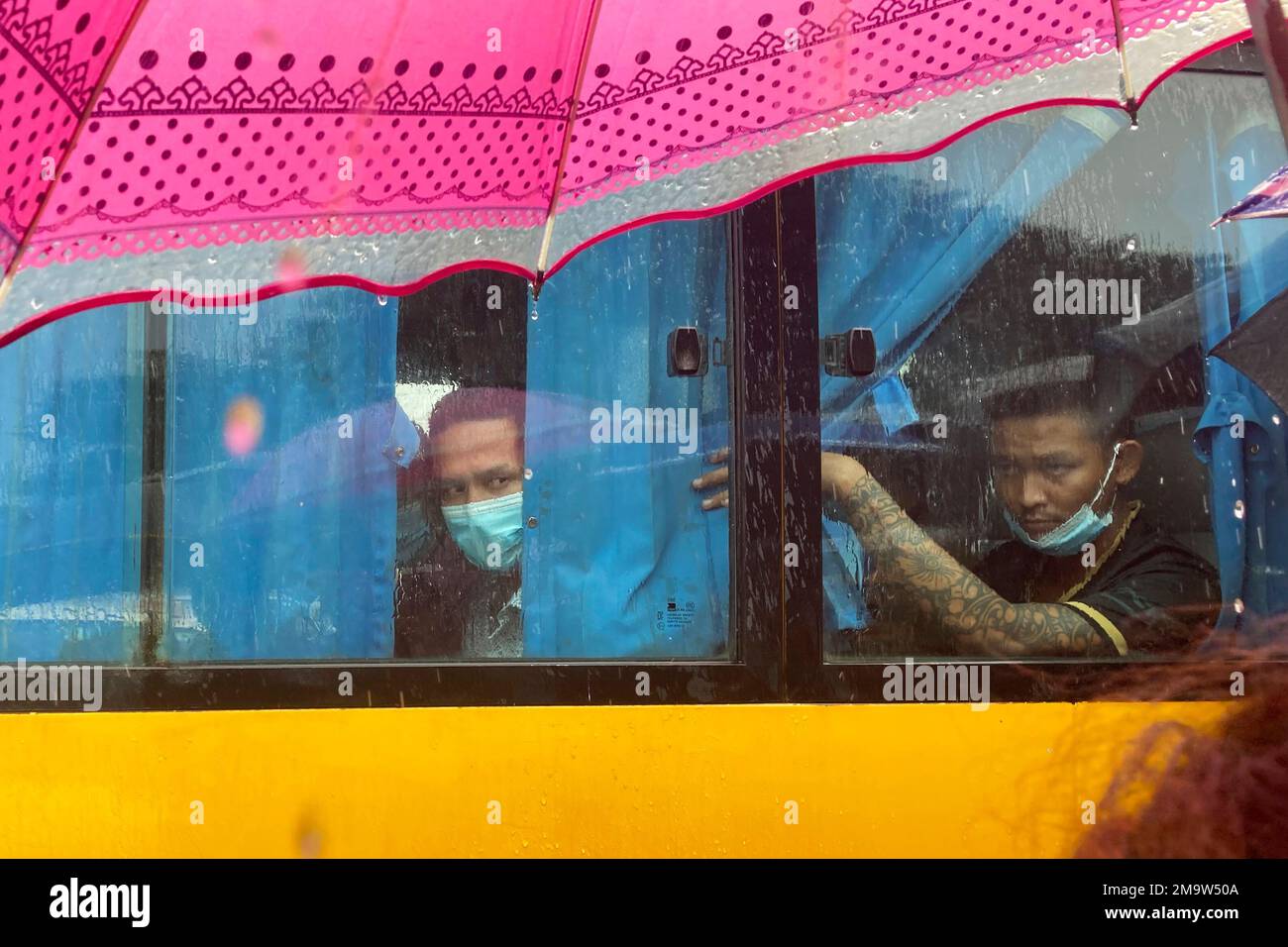 People look for their family members and relatives from a bus carrying ...