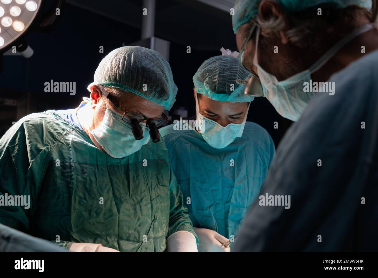 Open heart surgery doctor perform open heart surgery. Doctors in green ...
