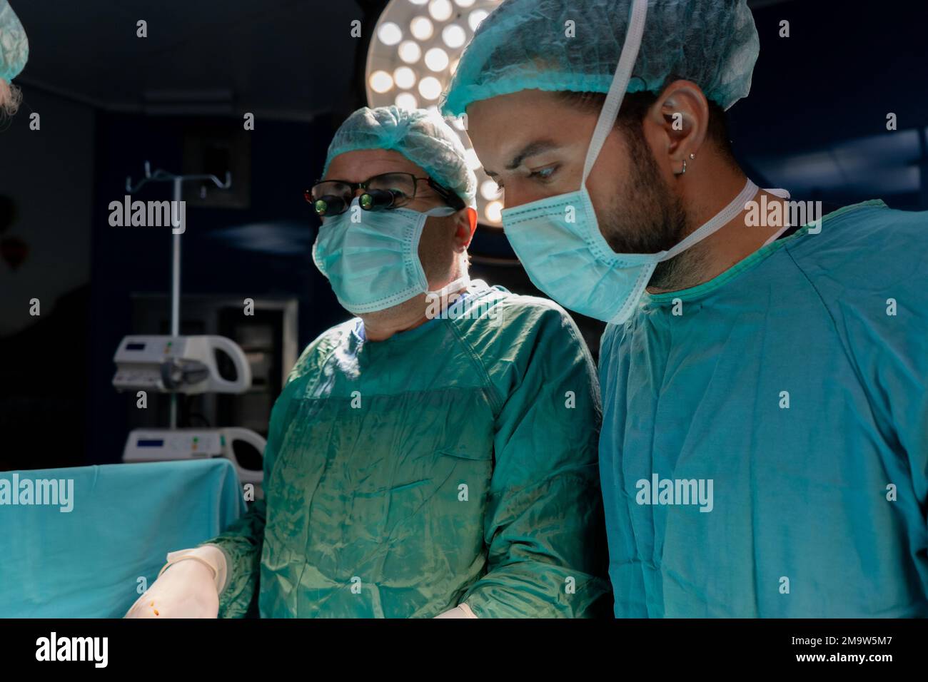 Open heart surgery doctor perform open heart surgery. Doctors in green ...