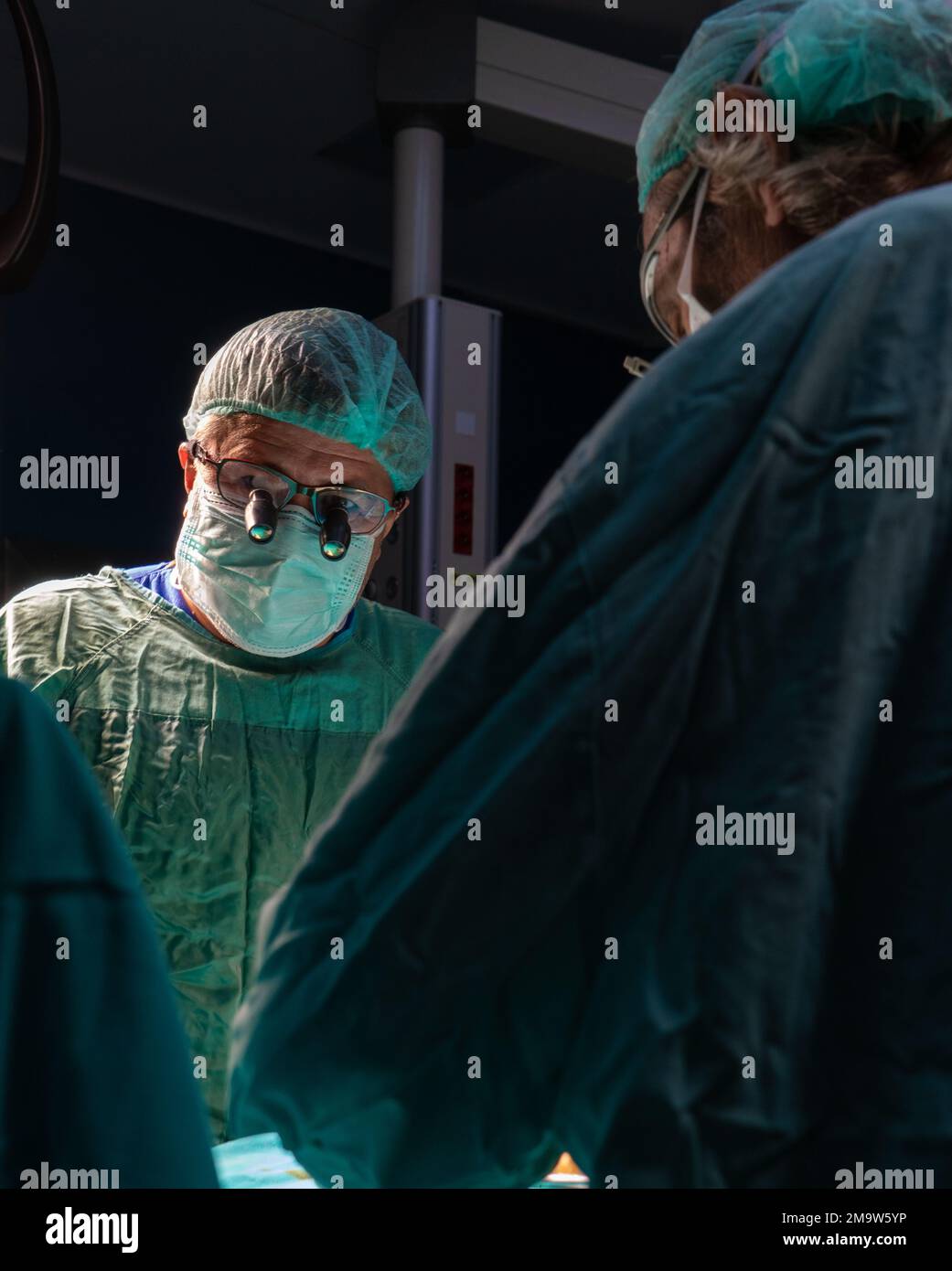 Open heart surgery doctor perform open heart surgery. Doctors in green ...