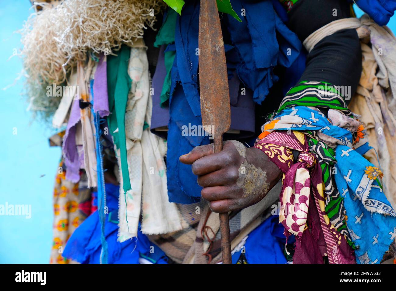 A Gule Wamkulu dance cult members holds a spear before performing their ...