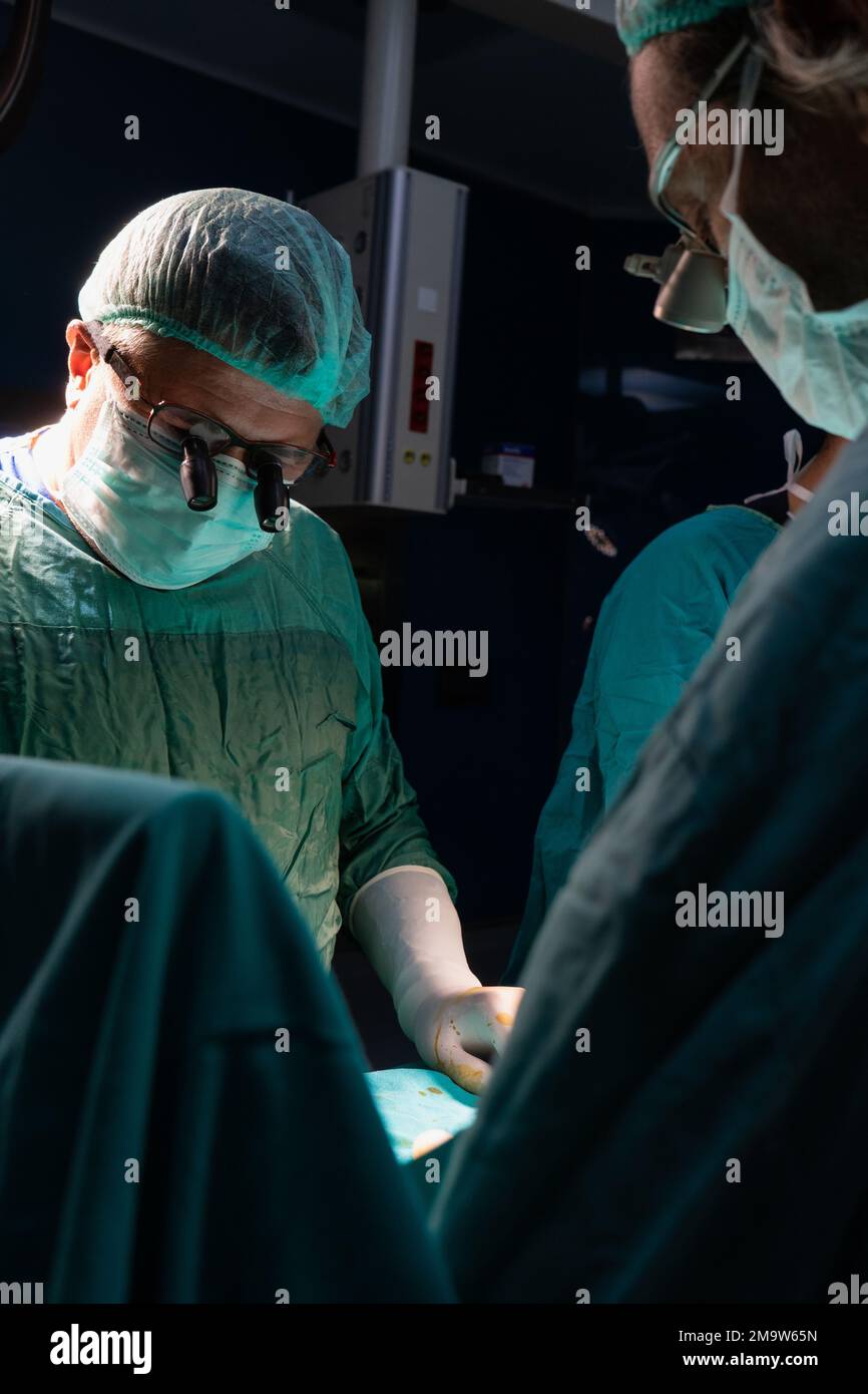 Open heart surgery doctor perform open heart surgery. Doctors in green ...
