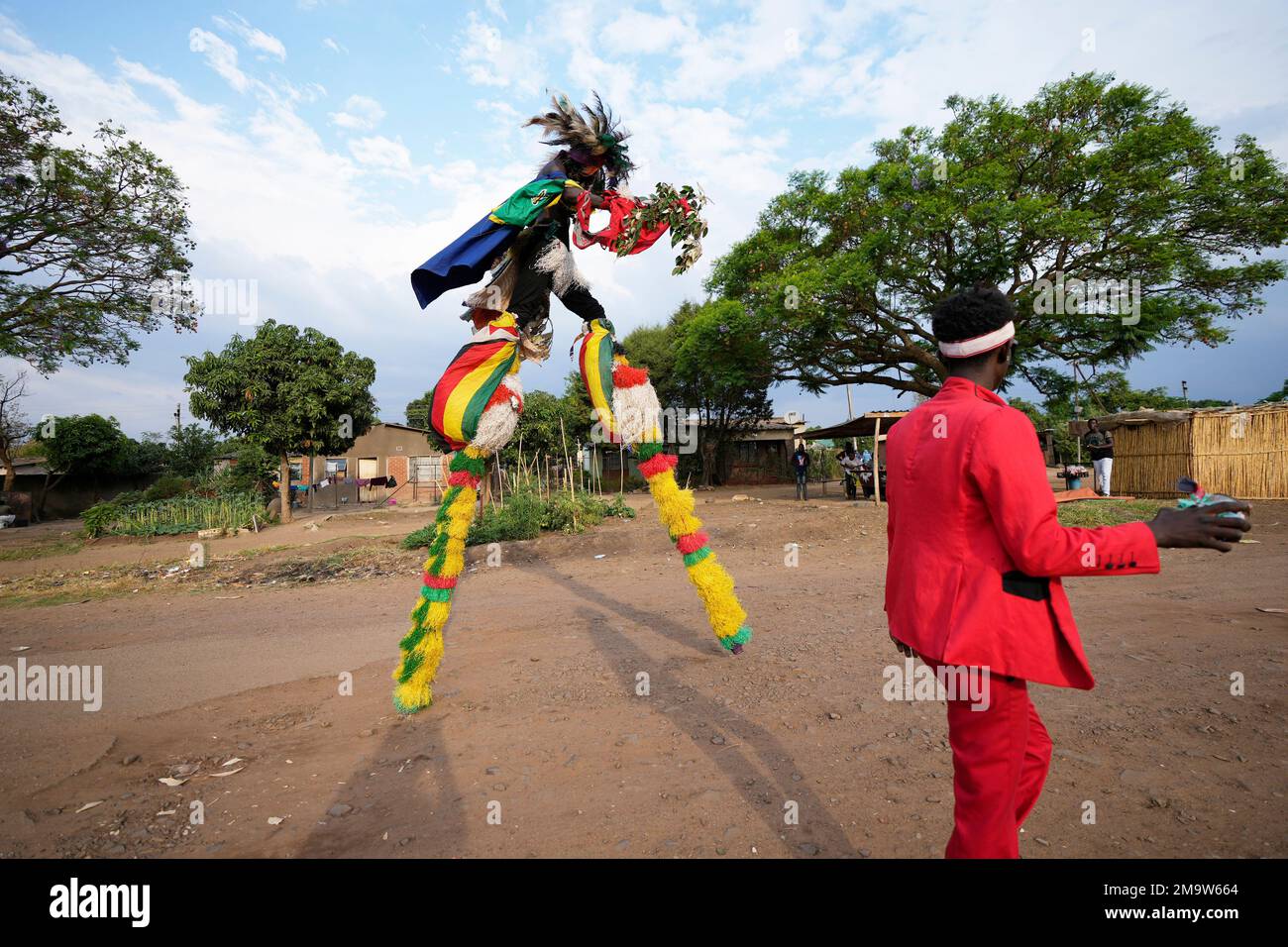 Gule Wamkulu dance secretive society members in gory masks and colorful ...