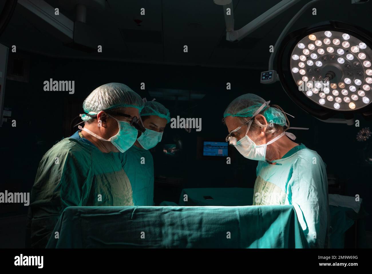 Open heart surgery doctor perform open heart surgery. Doctors in green ...