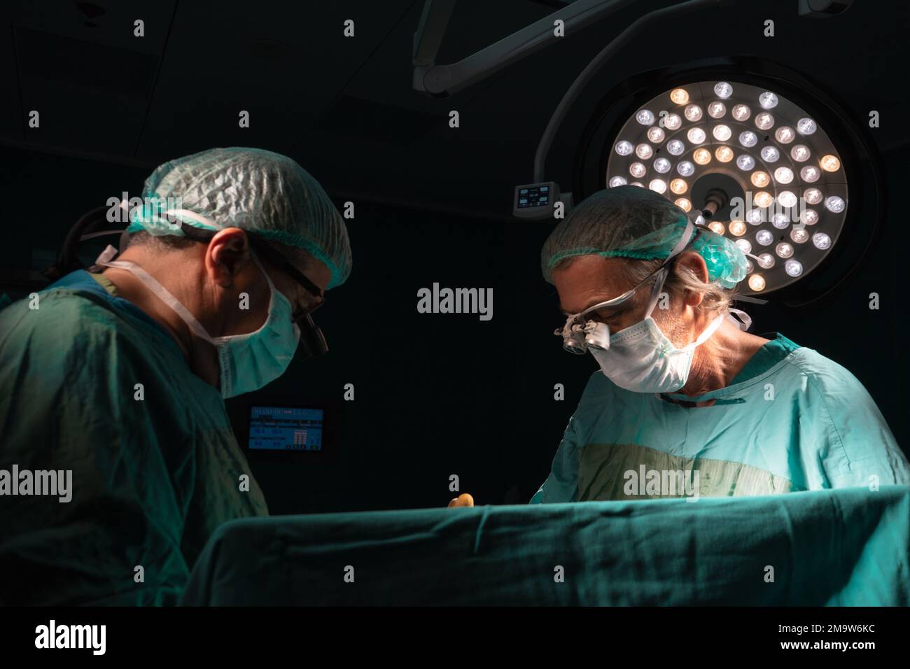 Open heart surgery doctor perform open heart surgery. Doctors in green ...