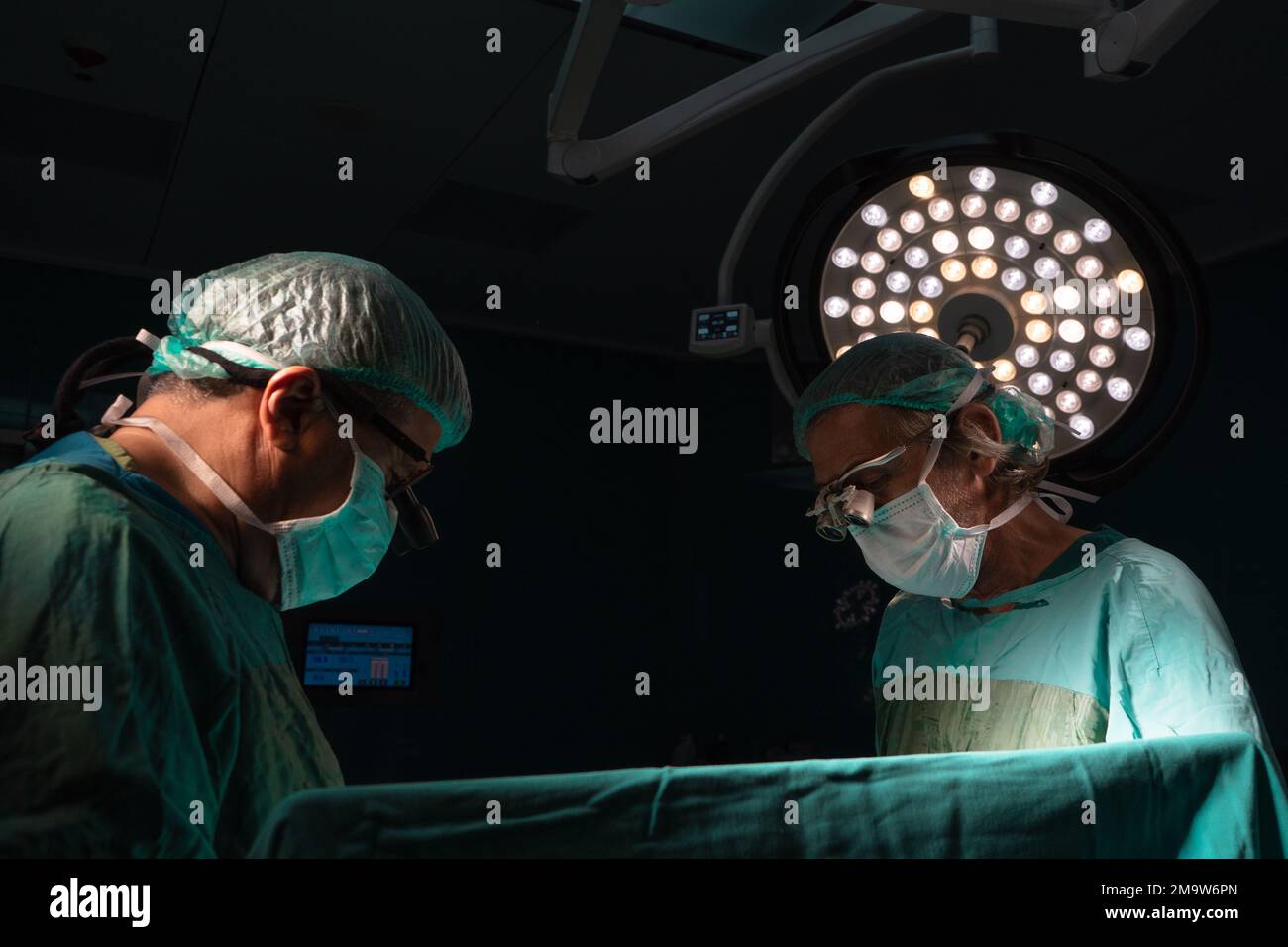 Open heart surgery doctor perform open heart surgery. Doctors in green ...