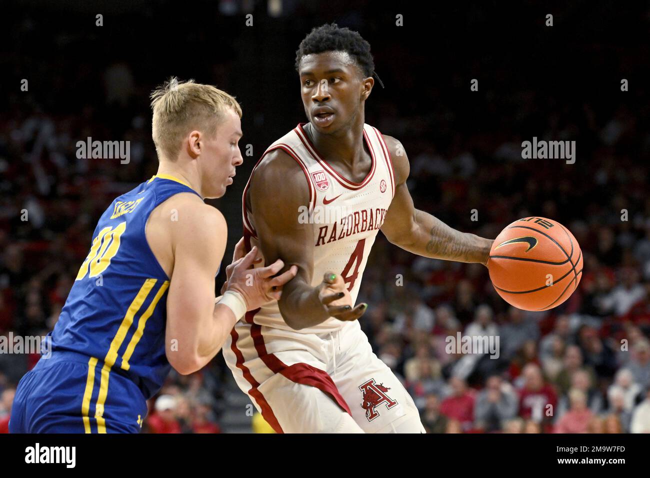 Arkansas guard Davonte Davis (4) tries to get past South Dakota State ...