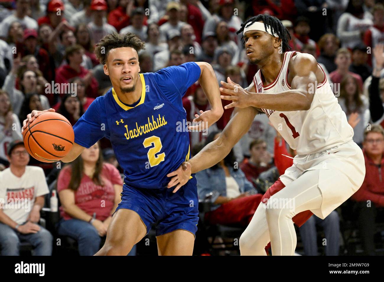 South Dakota State guard Zeke Mayo (2) tries to get past Arkansas guard ...