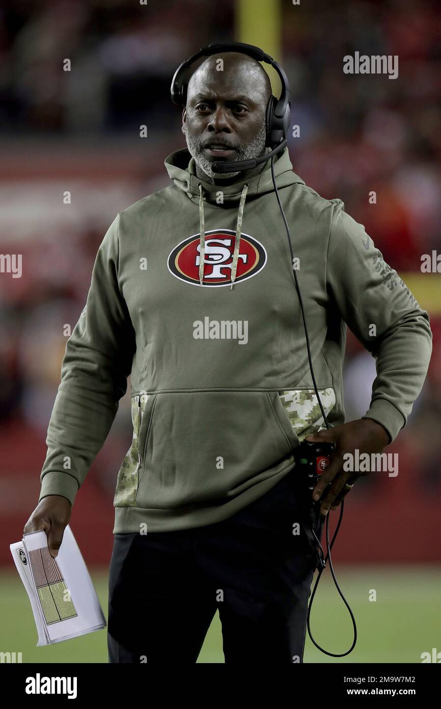 San Francisco 49ers assistant head coach Anthony Lynn walks on the ...