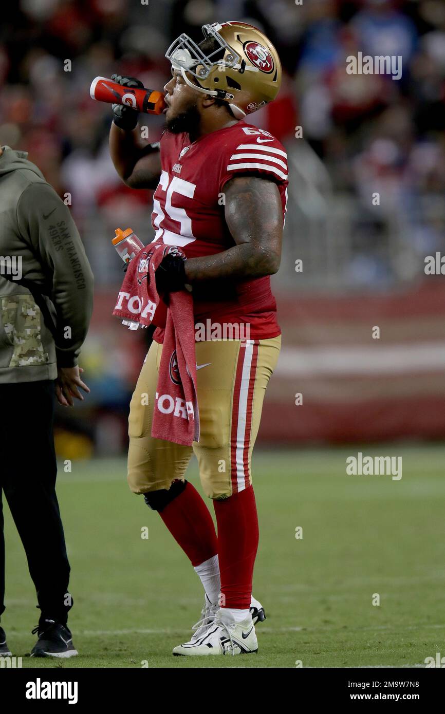 San Francisco 49ers guard Aaron Banks (65) drinks Gatorade during a ...