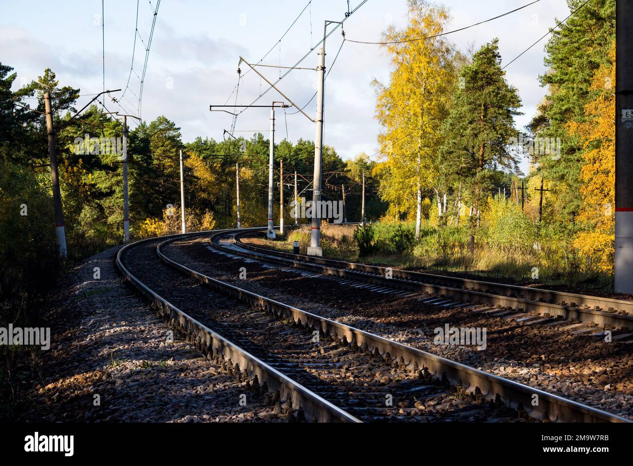 Rails on a double-track railway turning right Stock Photo - Alamy