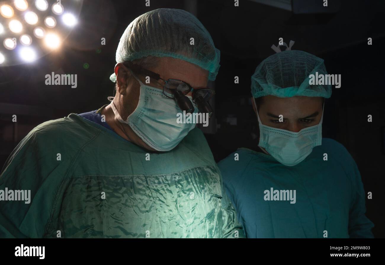 Open heart surgery doctor perform open heart surgery. Doctors in green ...