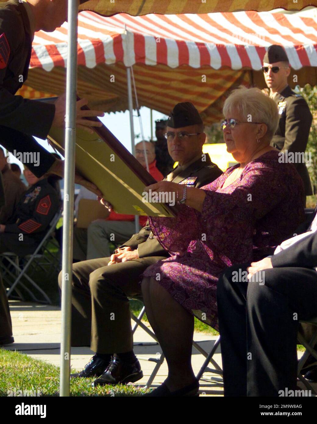 031114-M-5325O-031. Mrs. Joan Dawson receives cased colors for 4th ...