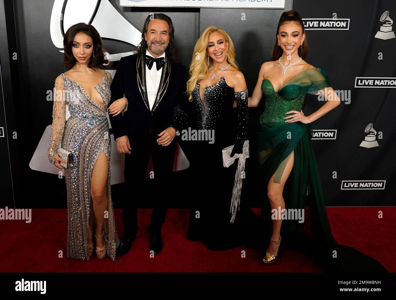 Honoree Marco Antonio Solis, center left, and Alison Solis, from left ...