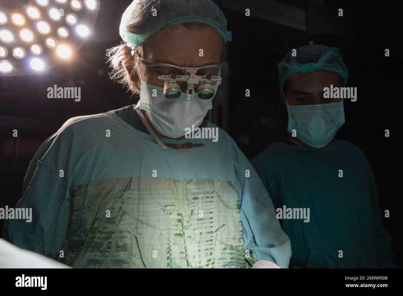 Open heart surgery doctor perform open heart surgery. Doctors in green ...